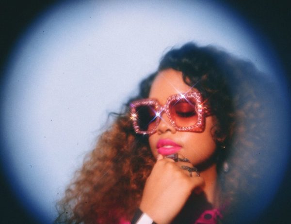 H.E.R. talks about her name and clues us into her original sound